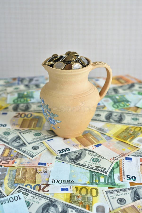 Jug with coins on a table stock photo. Image of capital - 188716548
