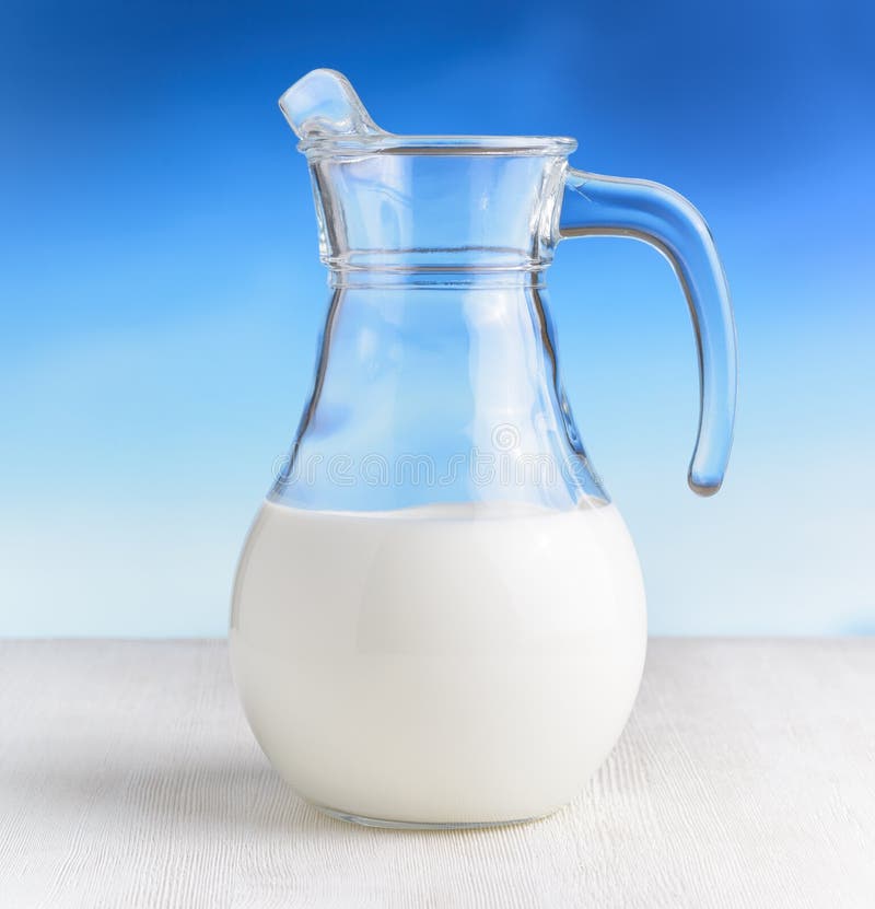 Jug of Milk on Sky Background. Half Full Pitcher Stock Image - Image of ...