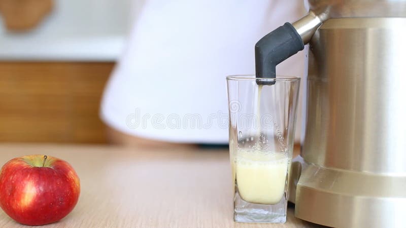 Juicer Making Orange Fruit Juice. Close Up of Juicing Machine and ...