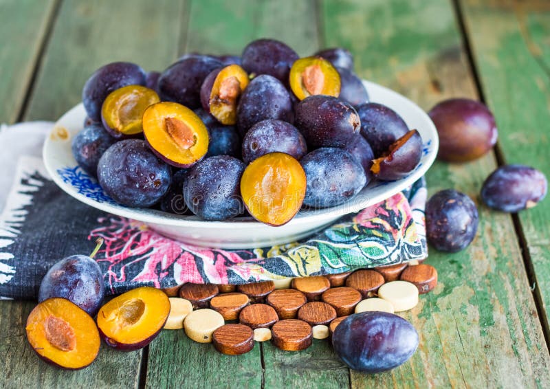 Juicy Blue Plum Slices in a Circular Plate, Horizontally Stock Photo ...