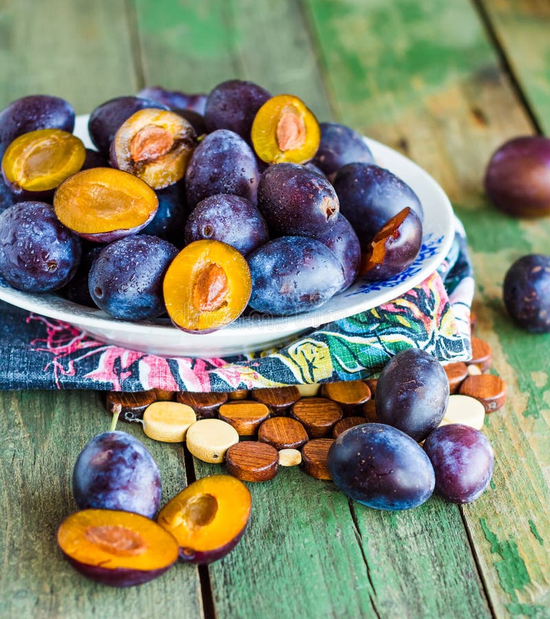 Juicy Blue Plum Slices in a Circular Plate, Horizontally Stock Photo ...