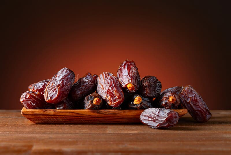 Juicy Ripe Dates on a Wooden Table Stock Photo - Image of dates ...