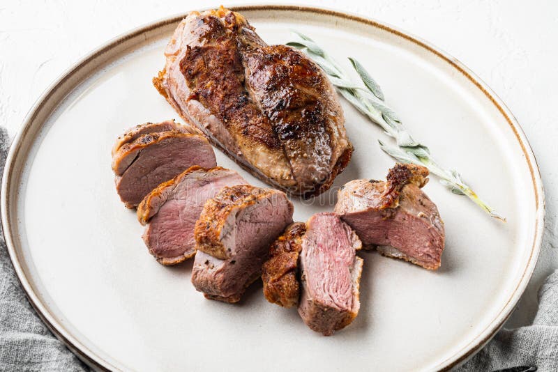 Juicy Duck Breast Steaks, on Plate, on White Stone Background Stock ...
