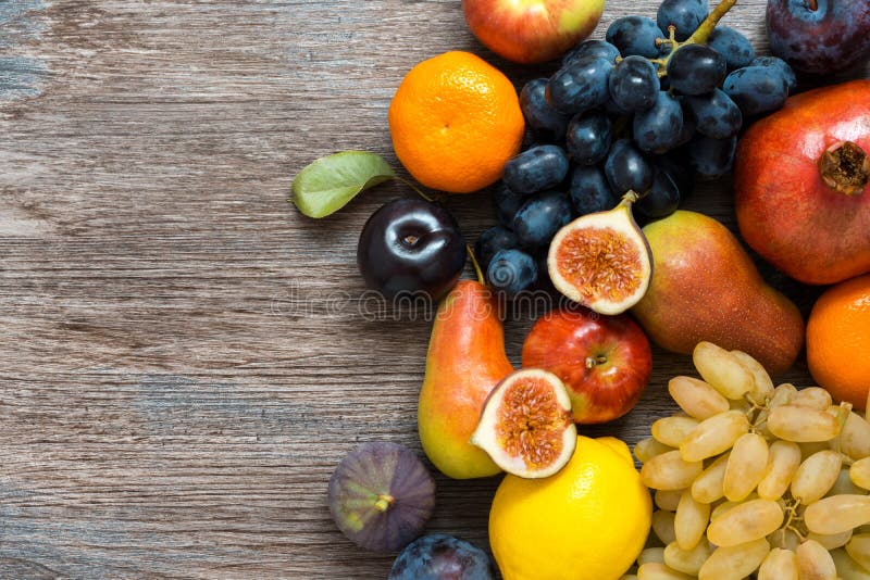 Juicy Fresh Fruit on a Wooden Dark Table, Top View. Stock Photo - Image ...