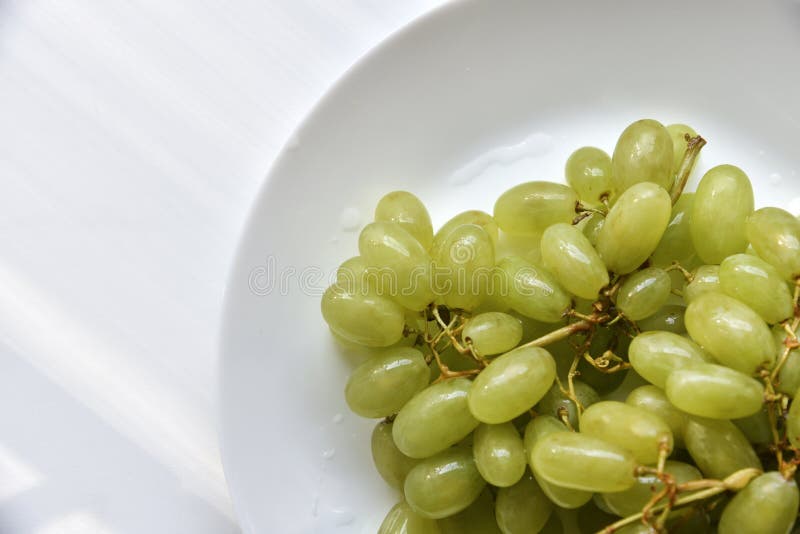 Juicy Fresh Grapes on a White Plate. Delicious Grapes Washed on a Plate ...