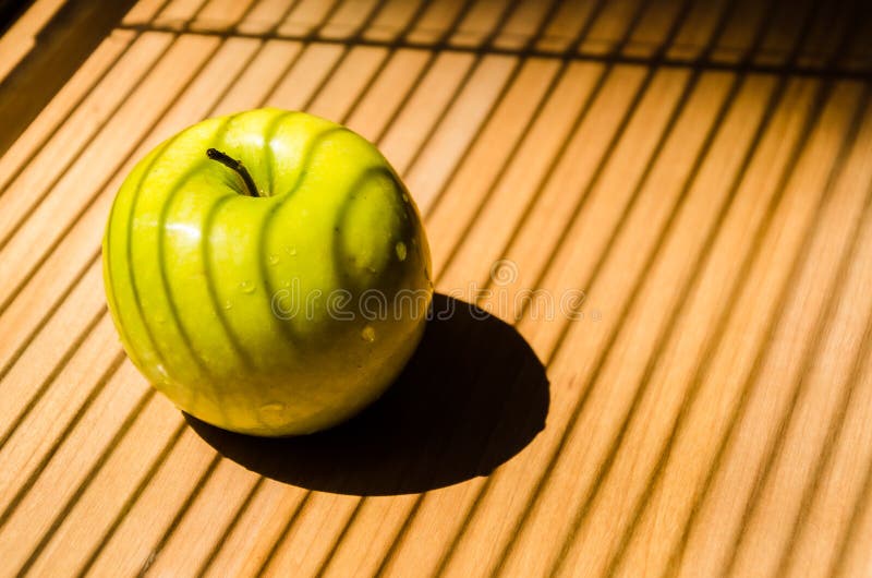 Juicy Green Apple with Drops of Water on Windowsill, Light and Shadow ...