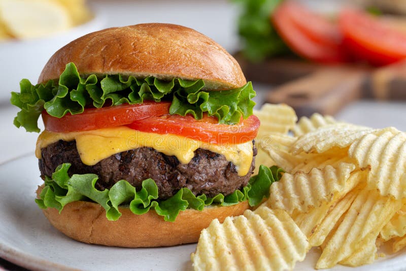 Juicy Grilled Cheeseburger and Chips Stock Photo - Image of meat, chips ...