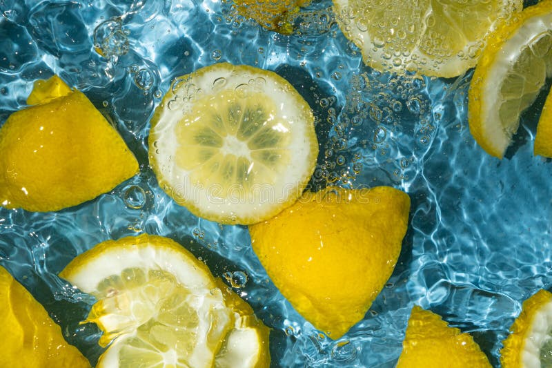 Juicy Lemon Background of Halves and Slices of Fresh Lemons in Water ...
