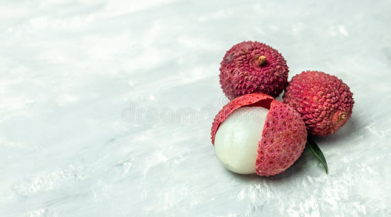 Juicy Lychee with Cut in Half and Leaves on a Light Background, Long ...