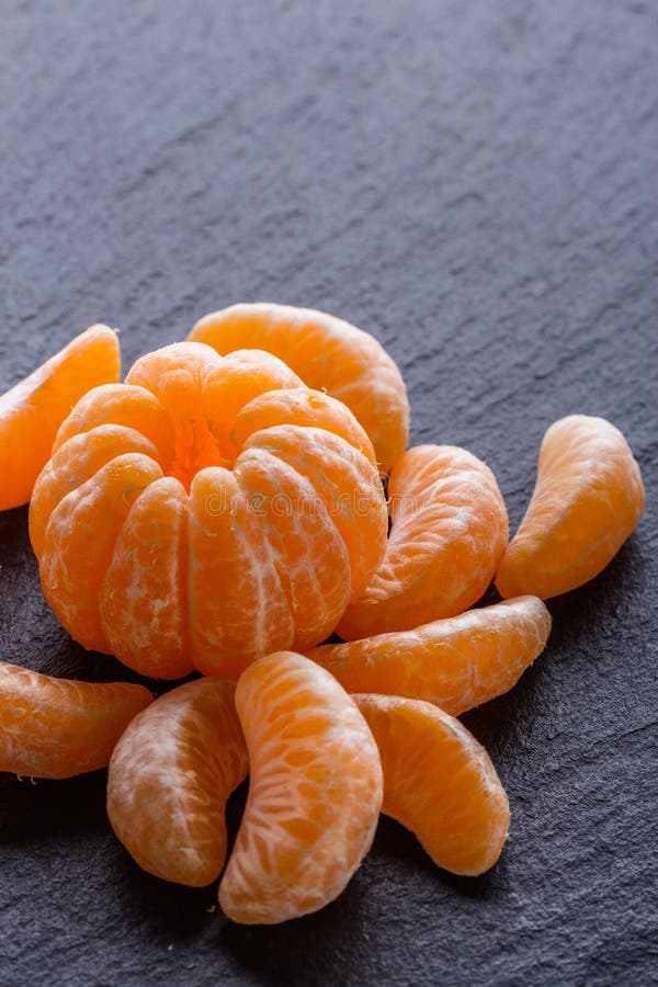 Juicy Mandarin on a Dark Stone Background Stock Photo - Image of ...