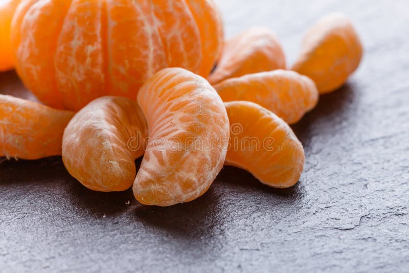 Juicy Mandarin on a Dark Stone Background Stock Photo - Image of rustic ...