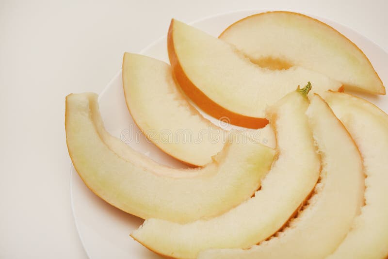 Juicy Melon on a Plate. Sweet Melon Cut into Pieces Stock Photo - Image ...