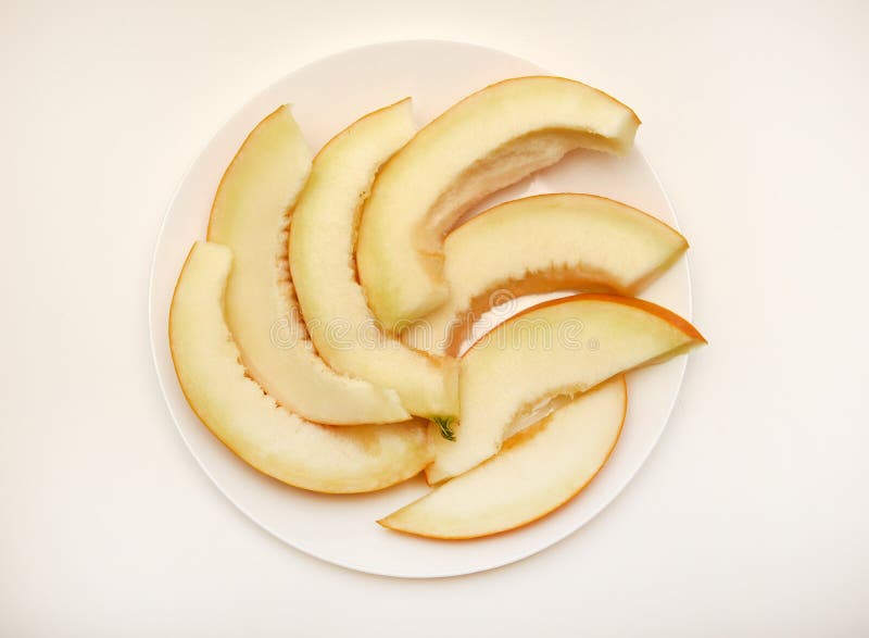 Juicy Melon on a Plate. Sweet Melon Cut into Pieces Stock Photo - Image ...