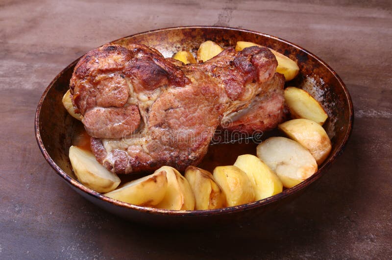 Juicy Pork Neck Chops are Grilled with Potatoes on a Stone Background ...