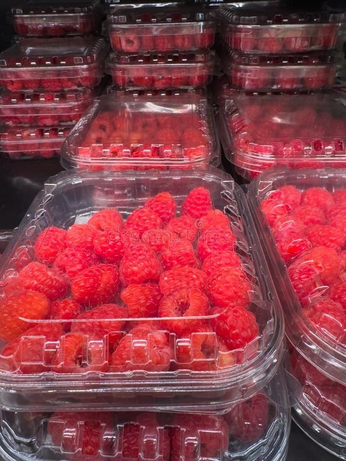 Juicy Raspberries Packed in Plastic Containers at the Mall, Close-up ...