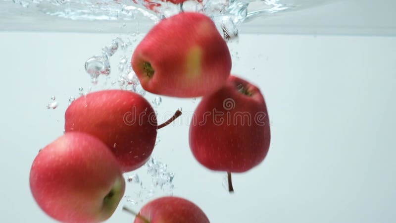 Juicy Red Apples Falling into Water. Slow Motion Splash. Stock Video ...