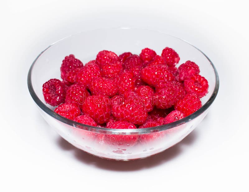 Juicy Red Raspberry Berry in a Transparent Glass Plate Stock Photo ...