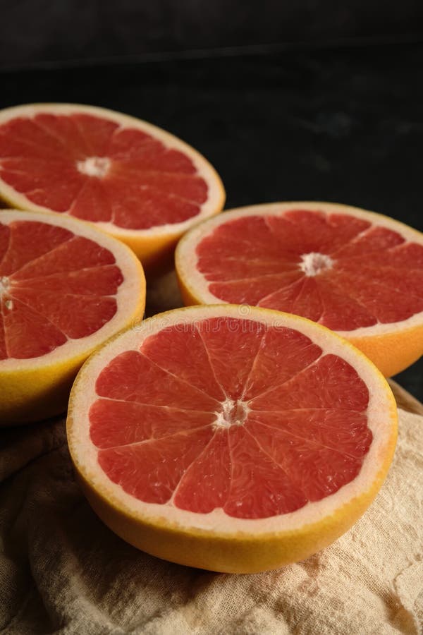Sliced Ripe Grapefruit on a Light Cloth Stock Image - Image of textile ...