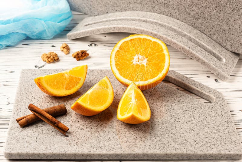 Juicy, Ripe Orange on a Cutting Board Made of Artificial Stone Stock ...