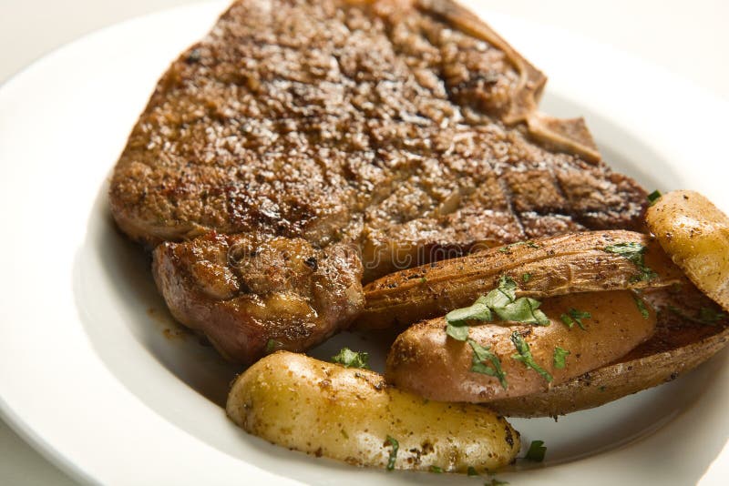 Juicy Steak and Potatoes stock image. Image of herbs, crosshatch - 6993059