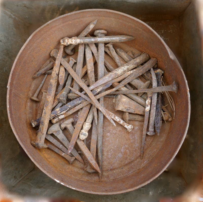 Jumble of Old Rusty Nails and Hand Tools in a Orange Plastic Box. Stock ...