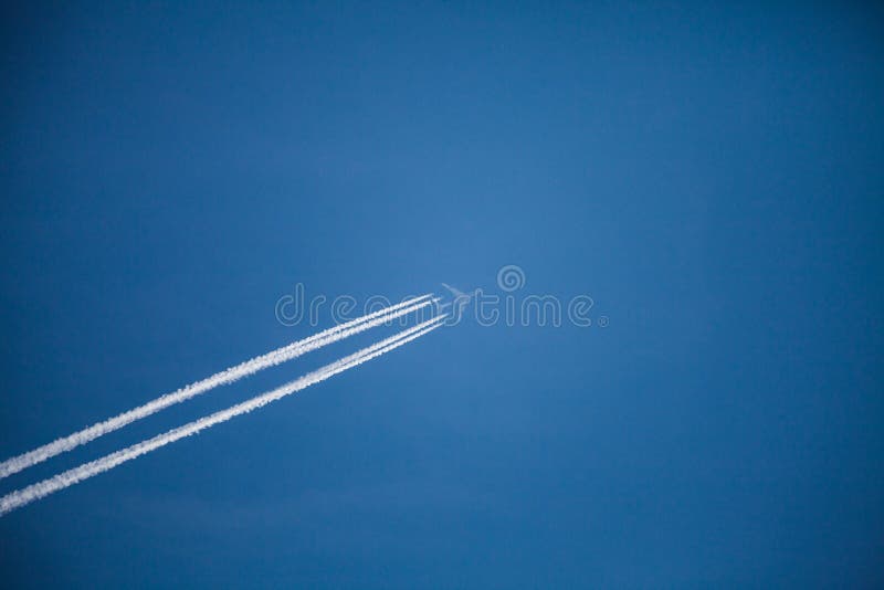 Jumbo Jet in Dizzy Height with Two White Condensation Trails Stock ...