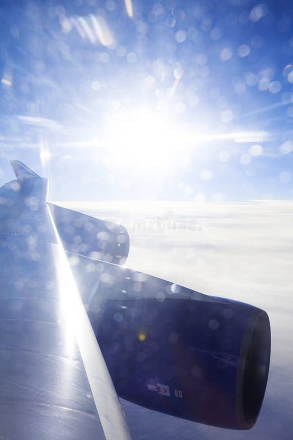 Jumbo Jet Wing Over Clouds Backlit by Amazing Sunset Stock Photo ...