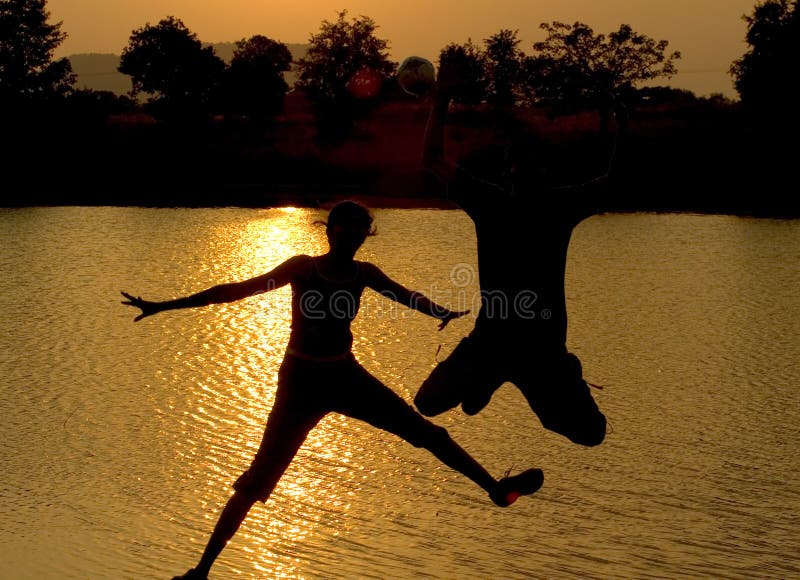 Sunset swim stock photo. Image of youth, exhuberance, jump - 192874
