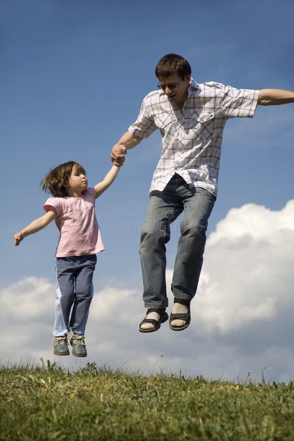 Jump of father and child stock image. Image of light, childhood - 9358905