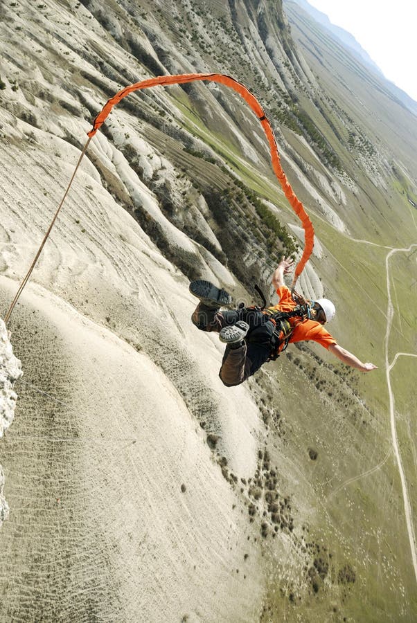 Jump off the cliff. stock photo. Image of people, color - 74371378