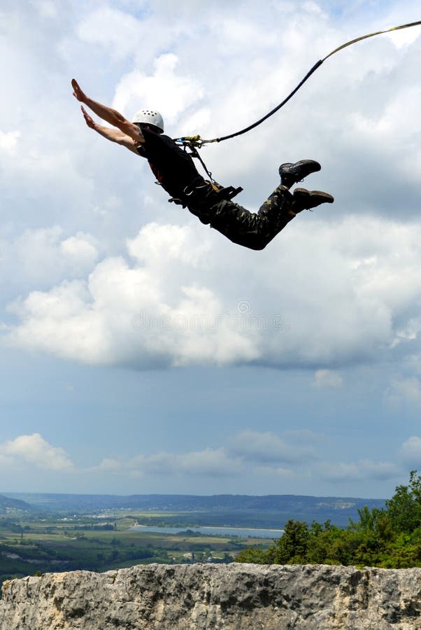 Jump off the cliff. stock image. Image of ropejumping - 74479171