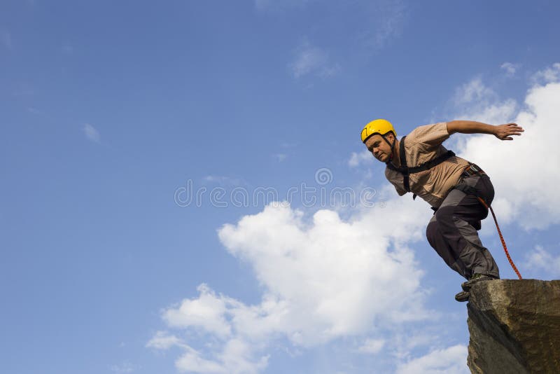 Jump off a cliff. stock photo. Image of male, moving - 76284840