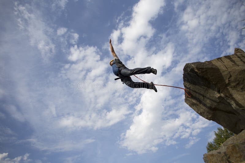 Jump off a cliff. stock photo. Image of moving, outdoors - 76293842