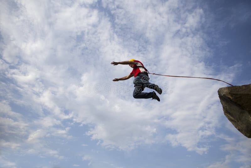 Jump off a cliff. stock photo. Image of bungee, falling - 76298414