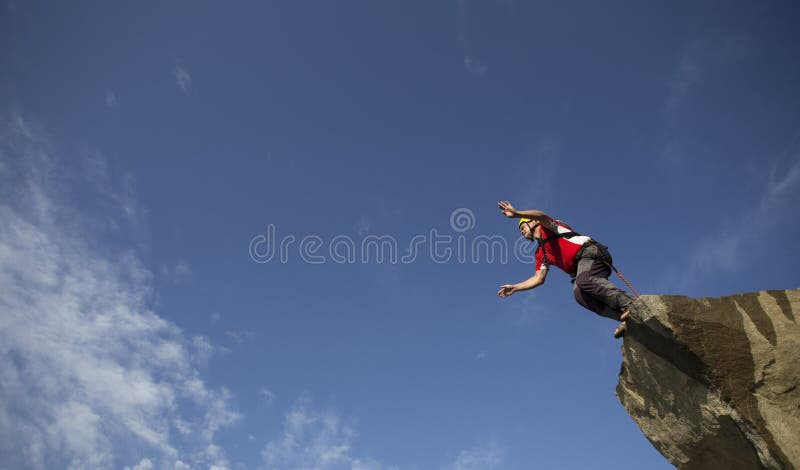 Jump off a cliff. stock photo. Image of moving, high - 76504860