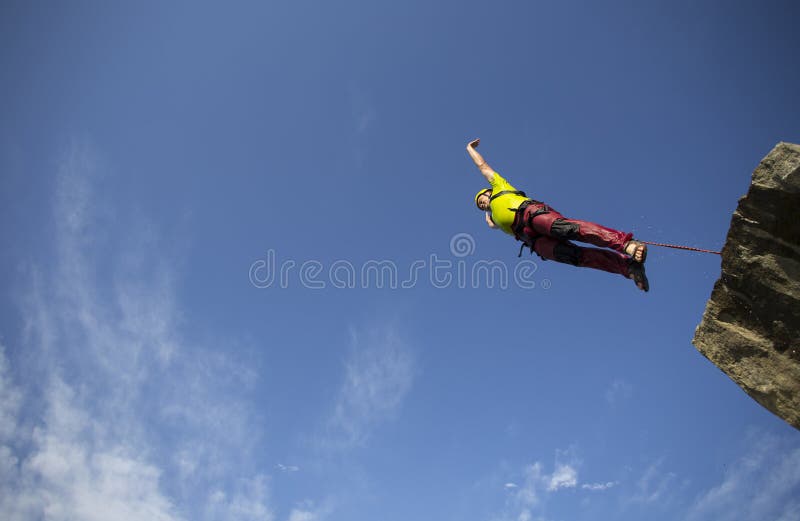 Jump off a cliff. stock photo. Image of rope, challenge - 76505124