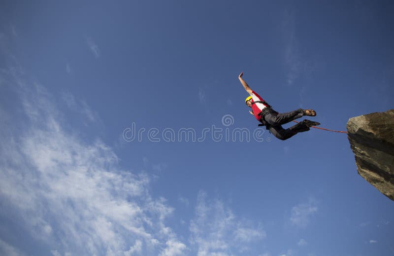 Jump off a cliff. stock image. Image of rope, color, high - 76505385