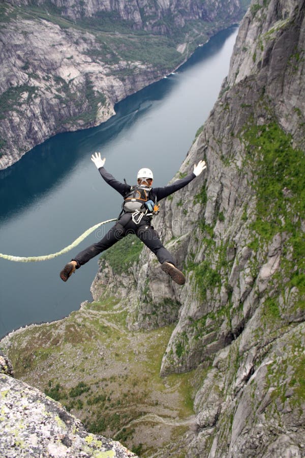 Jump Off a Cliff with a Rope. Stock Photo - Image of jumpsuit ...