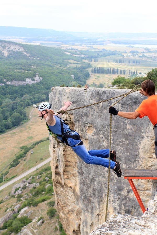 Jump Off a Cliff with a Rope. Stock Image - Image of adventure, male ...