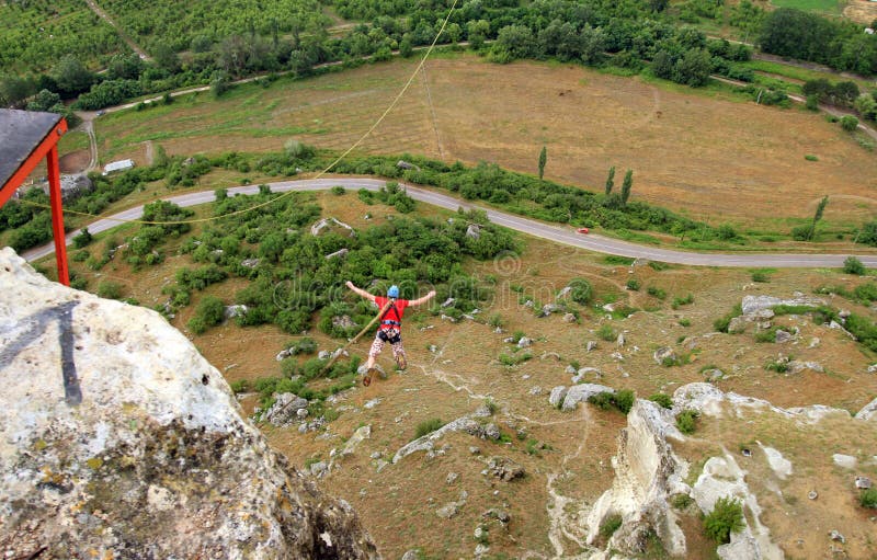 Jump Off a Cliff with a Rope. Stock Image - Image of moving, confidence ...