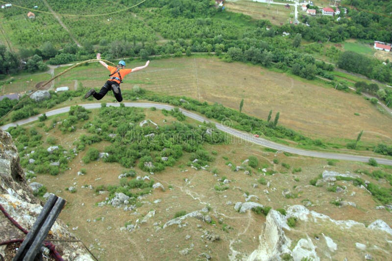 Jump Off A Cliff With A Rope. Stock Photo - Image of adventure, clear ...
