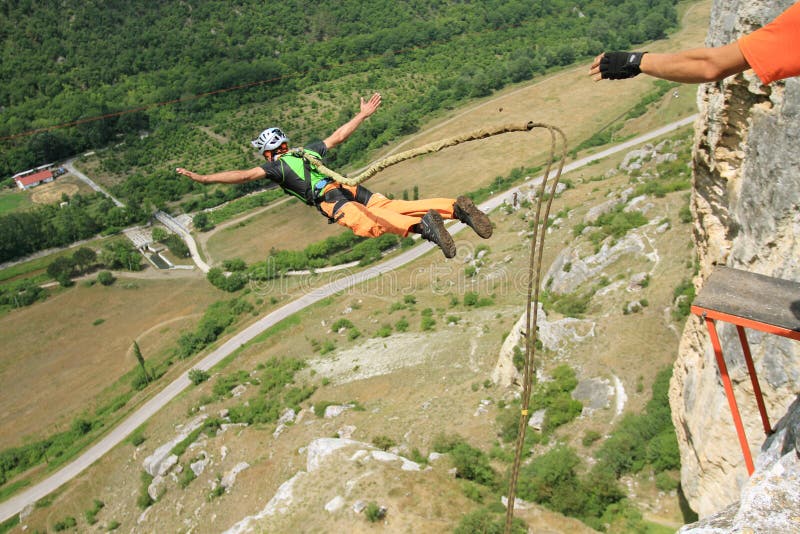 Jump Off a Cliff with a Rope. Stock Photo - Image of clear, freefall ...