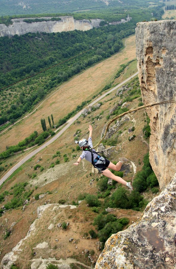 Jump Off a Cliff with a Rope. Stock Image - Image of freefall, high ...
