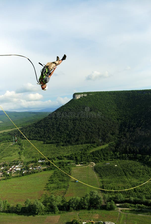 Jump Off a Cliff with a Rope.Bungee Jumping Stock Photo - Image of ...