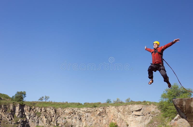 Jump Off the Cliff with a Rope. Stock Image - Image of falling ...