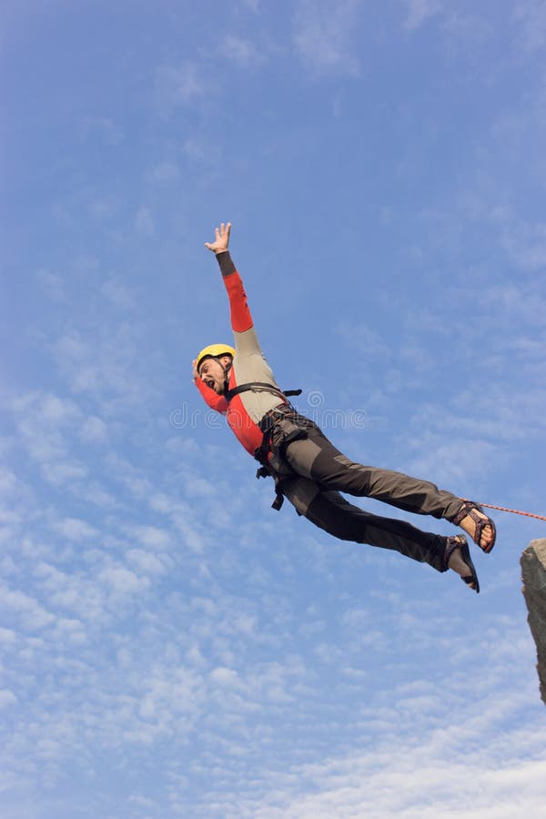 Jump Off the Cliff with a Rope. Stock Image - Image of falling ...