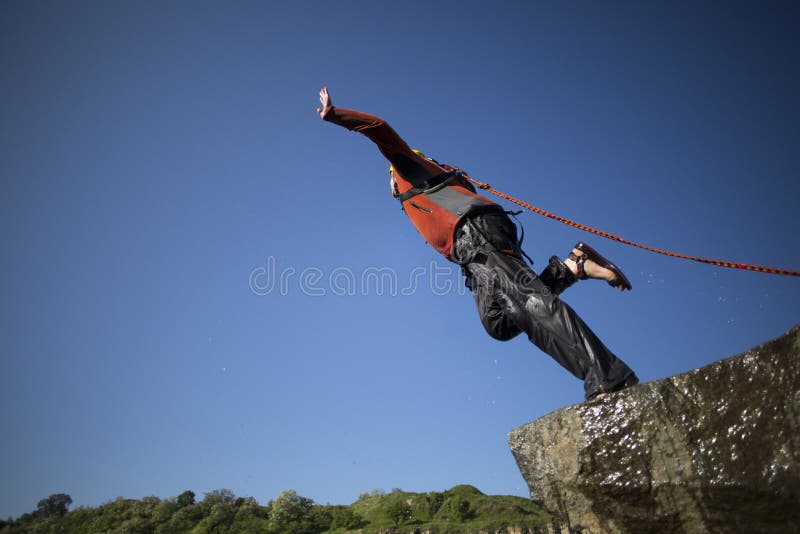 Jump Off a Cliff with a Rope. Stock Photo - Image of freefall, rock ...