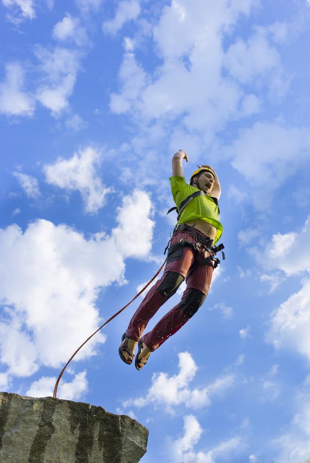 Jump Rope from a High Rock in the Mountains. Stock Image - Image of ...