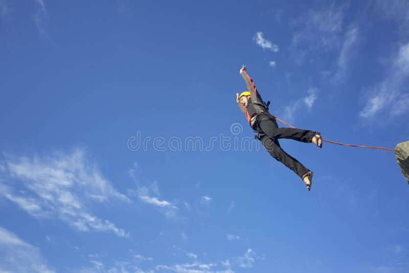 Jump Rope from a High Rock in the Mountains Stock Image - Image of ...