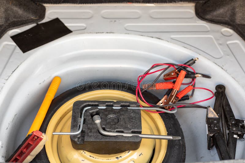 Jump Start Cable and Spare Tyre with Tyre Changing Tools Stock Photo ...